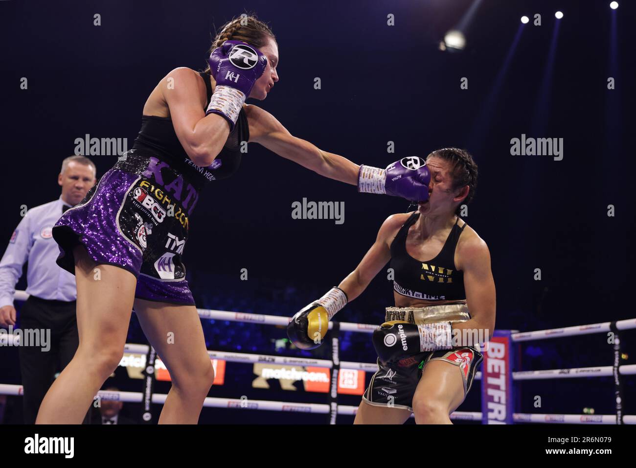 Katie Healy (left) hits out at Nina Hughes during the WBA Bantamweight ...