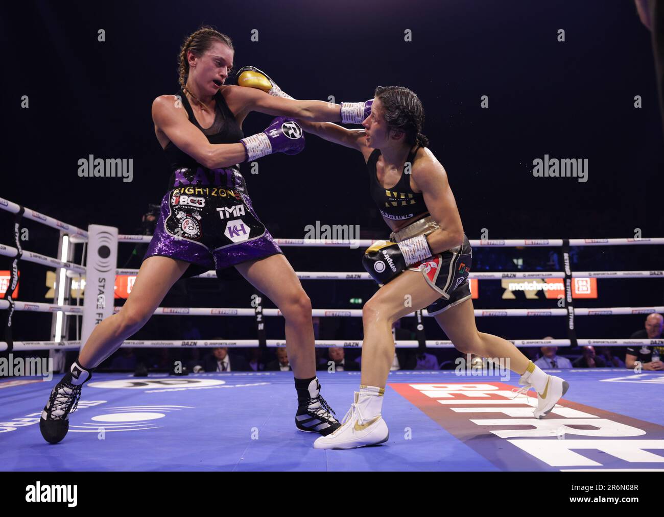 Nina Hughes (right) hits out at Katie Healy during the WBA Bantamweight ...