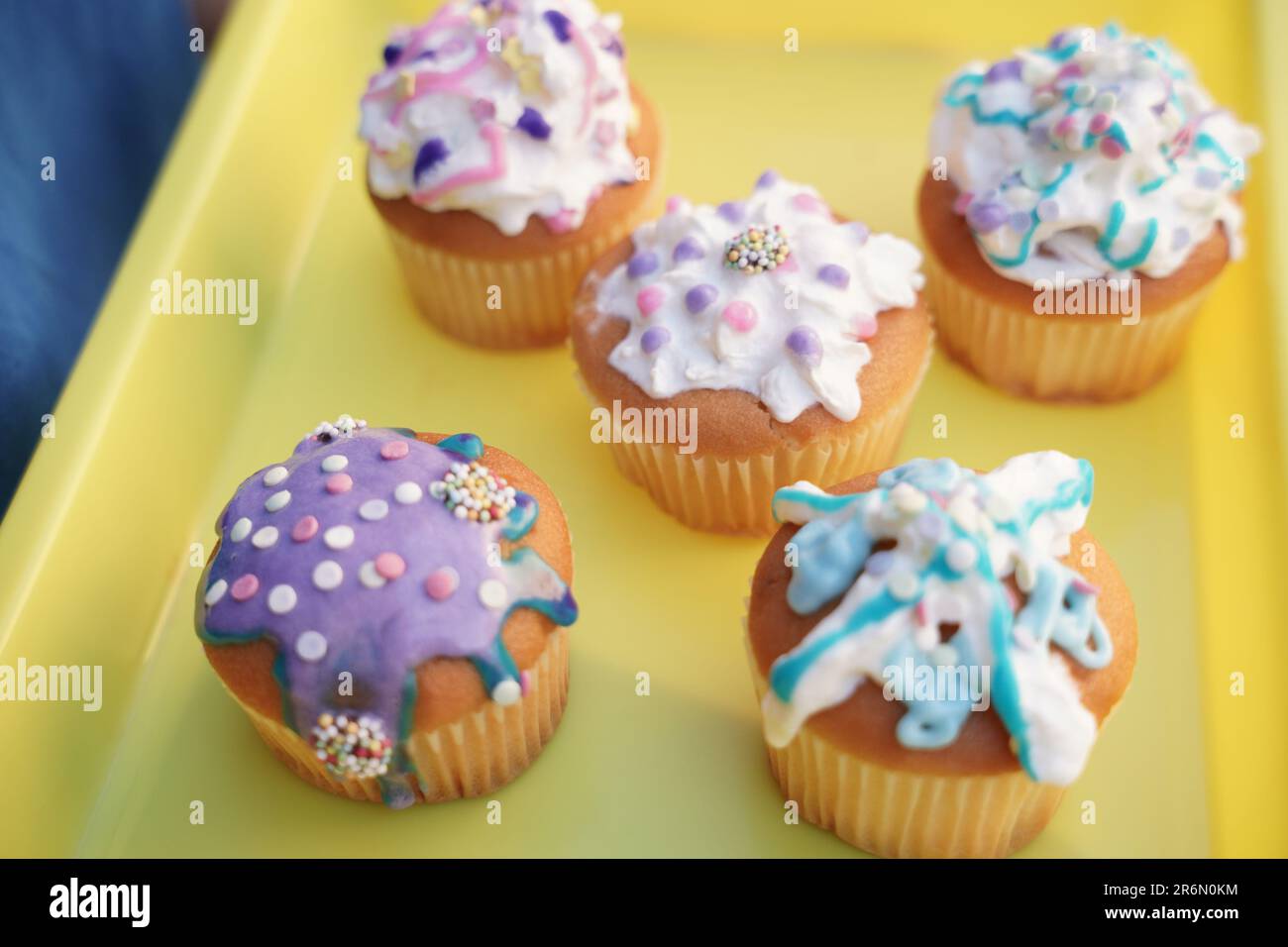 Kids home made cupcakes. many cupcakes with decoration, sprinkles and ...