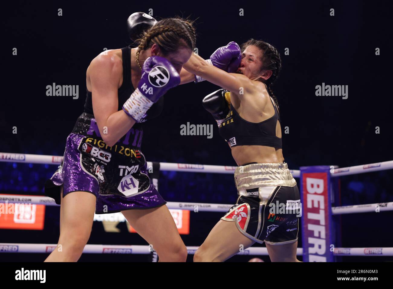 Katie Healy (left) punches Nina Hughes during the WBA Bantamweight ...