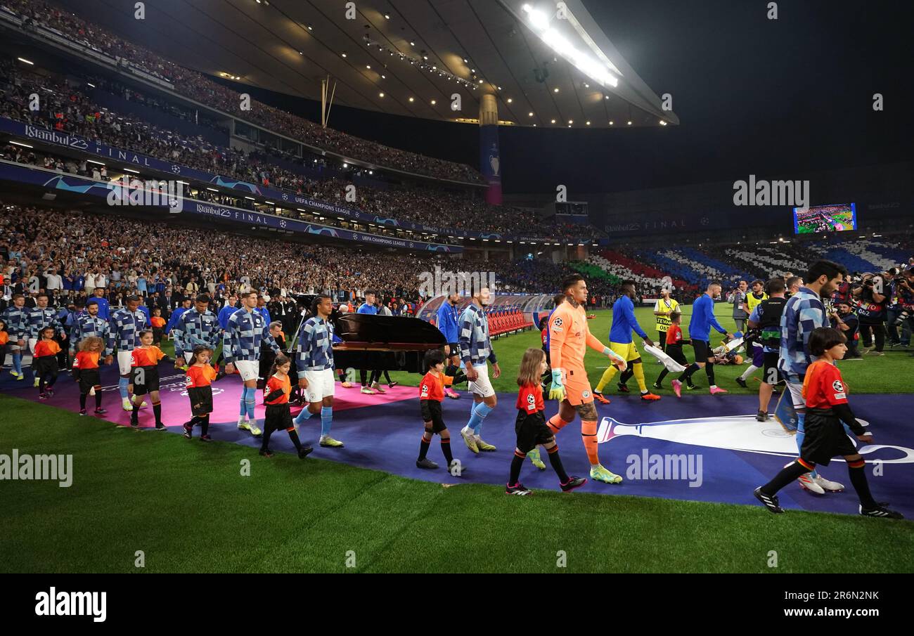Manchester City players walk out onto the pitch ahead of the UEFA ...