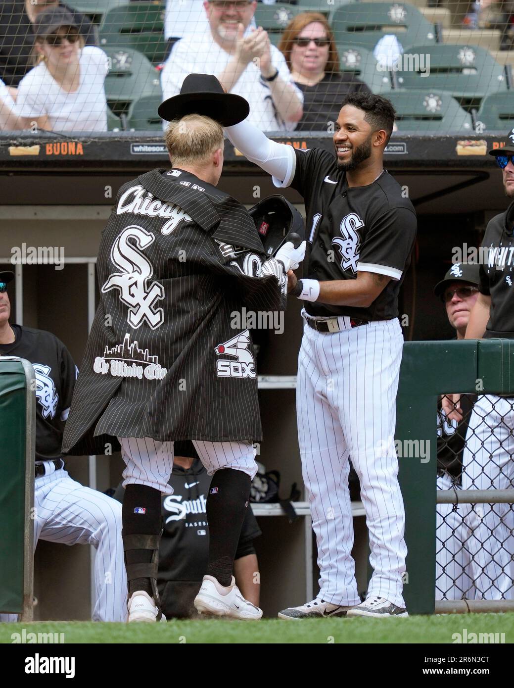 Chicago White Sox's Elvis Andrus, right, puts the home run coat and ...