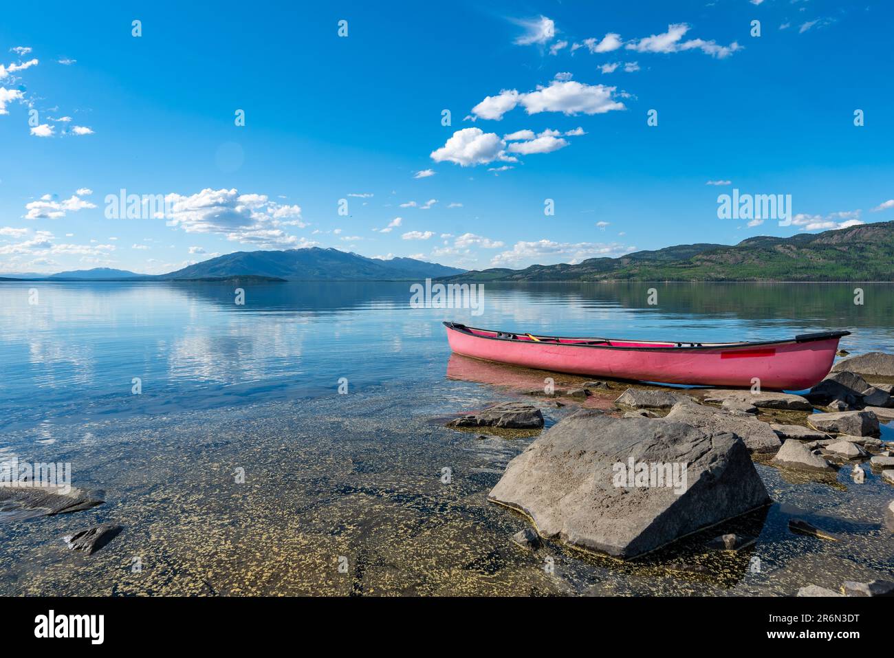 Summertime views in northern Canada with calm lake and mountain views ...