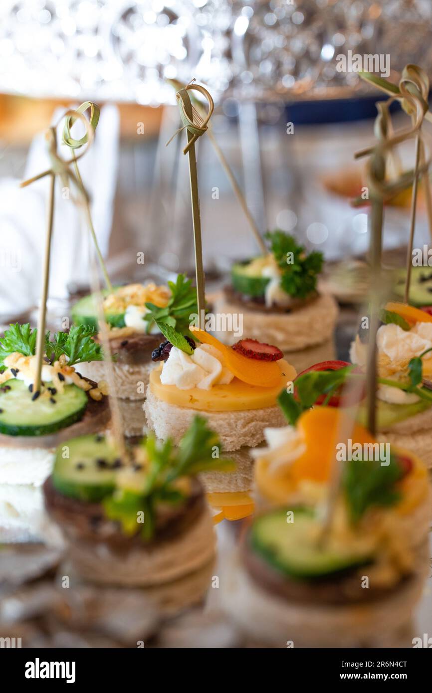 assorted canapes on a glass tray on a buffet table Stock Photo - Alamy