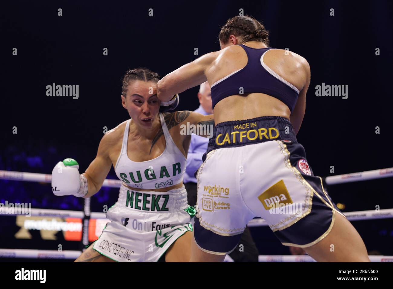 Cherneka Johnson (left) hits out at Ellie Scotney during the IBF Super-Bantamweight World Title ...