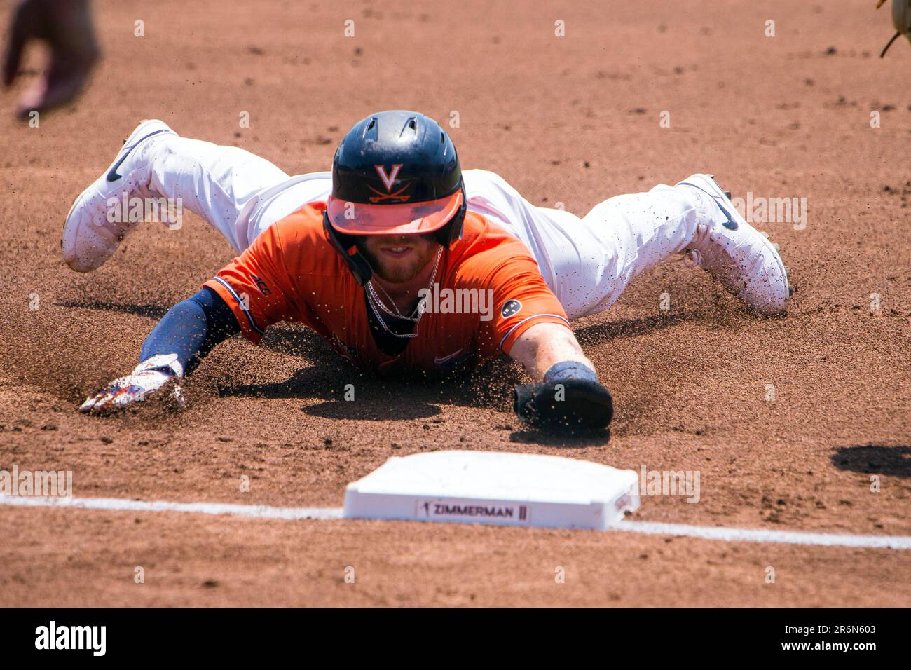 Virginia's Ethan Anderson slides into third base in second inning ...