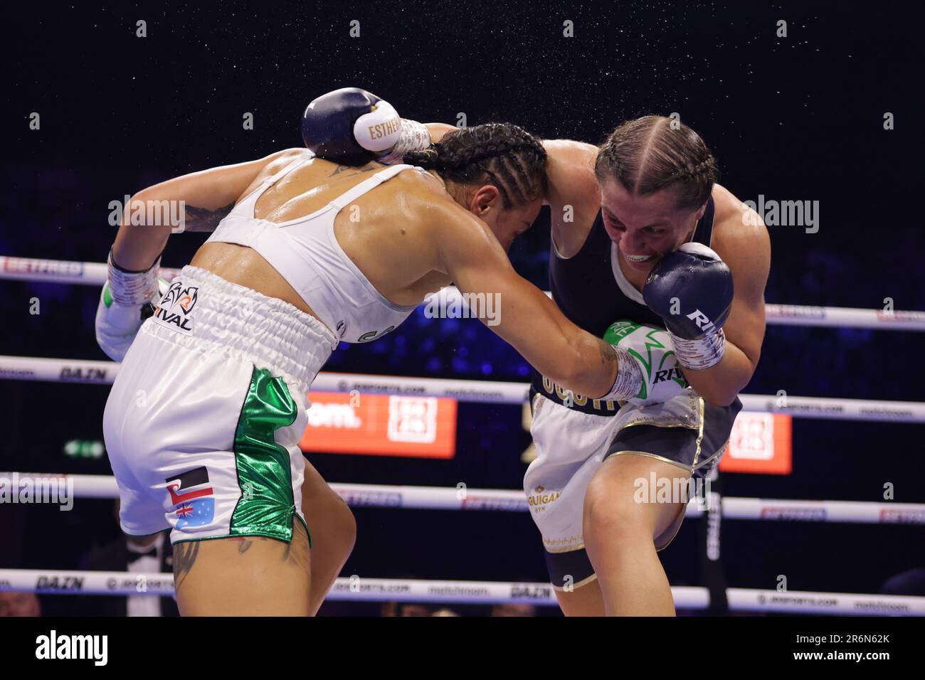 Cherneka Johnson (left) hits out at Ellie Scotney during the IBF Super ...