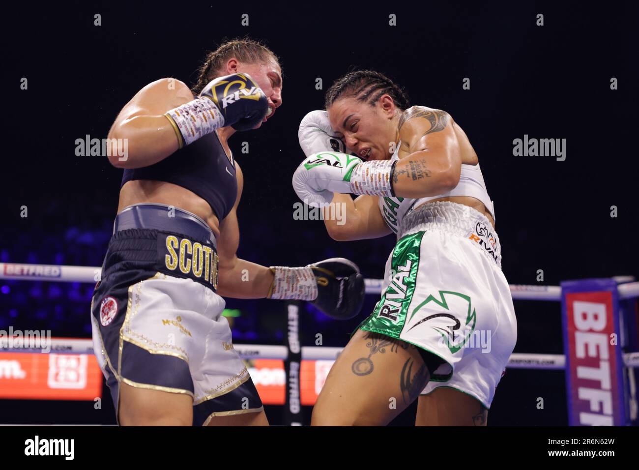 Ellie Scotney (left) hits out at Cherneka Johnson during the IBF Super ...