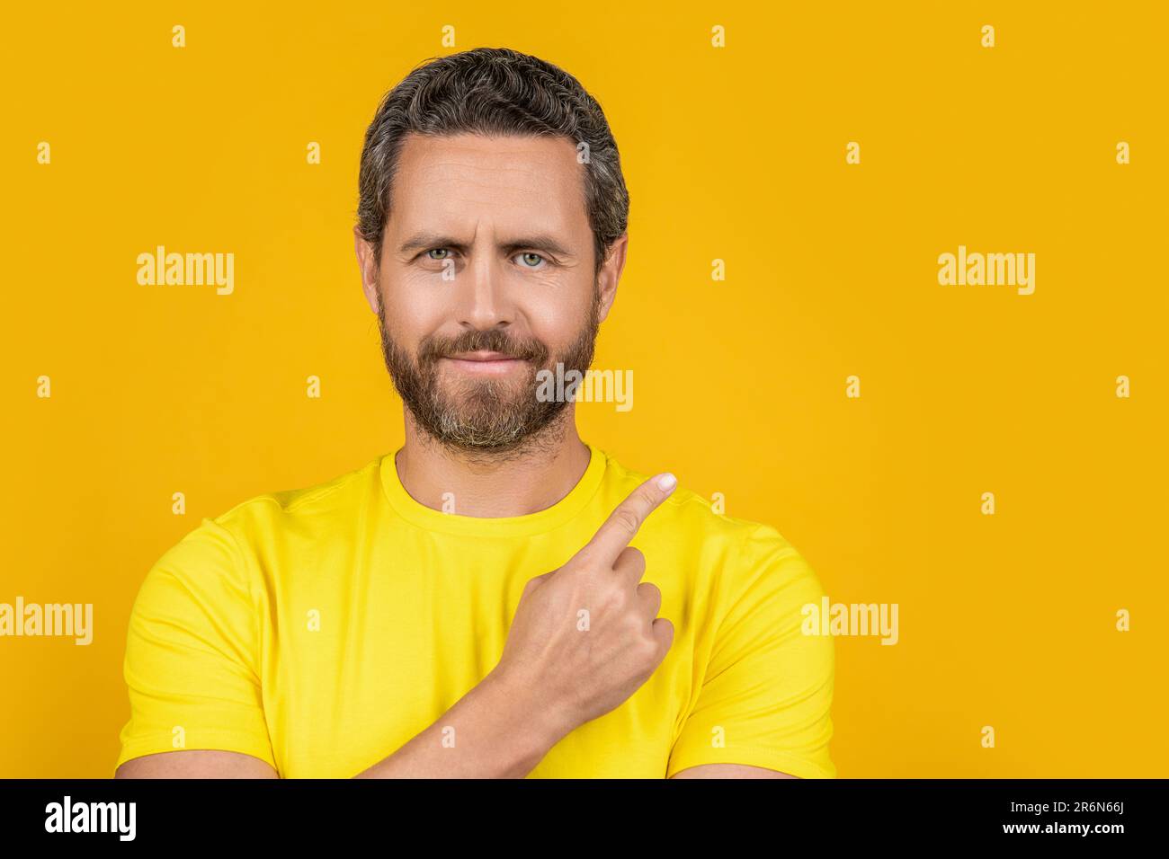 man smile pointing at advertisement offer in studio. photo of man ...