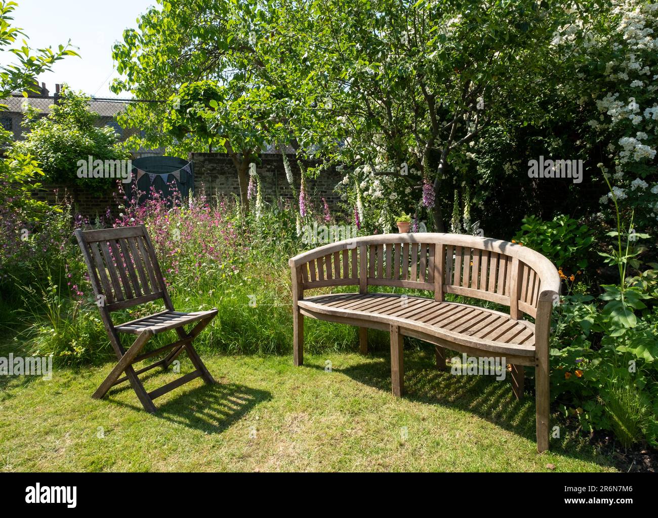 Garden in Fournier Street, Spitalfields, with foxgloves growing amongst ...
