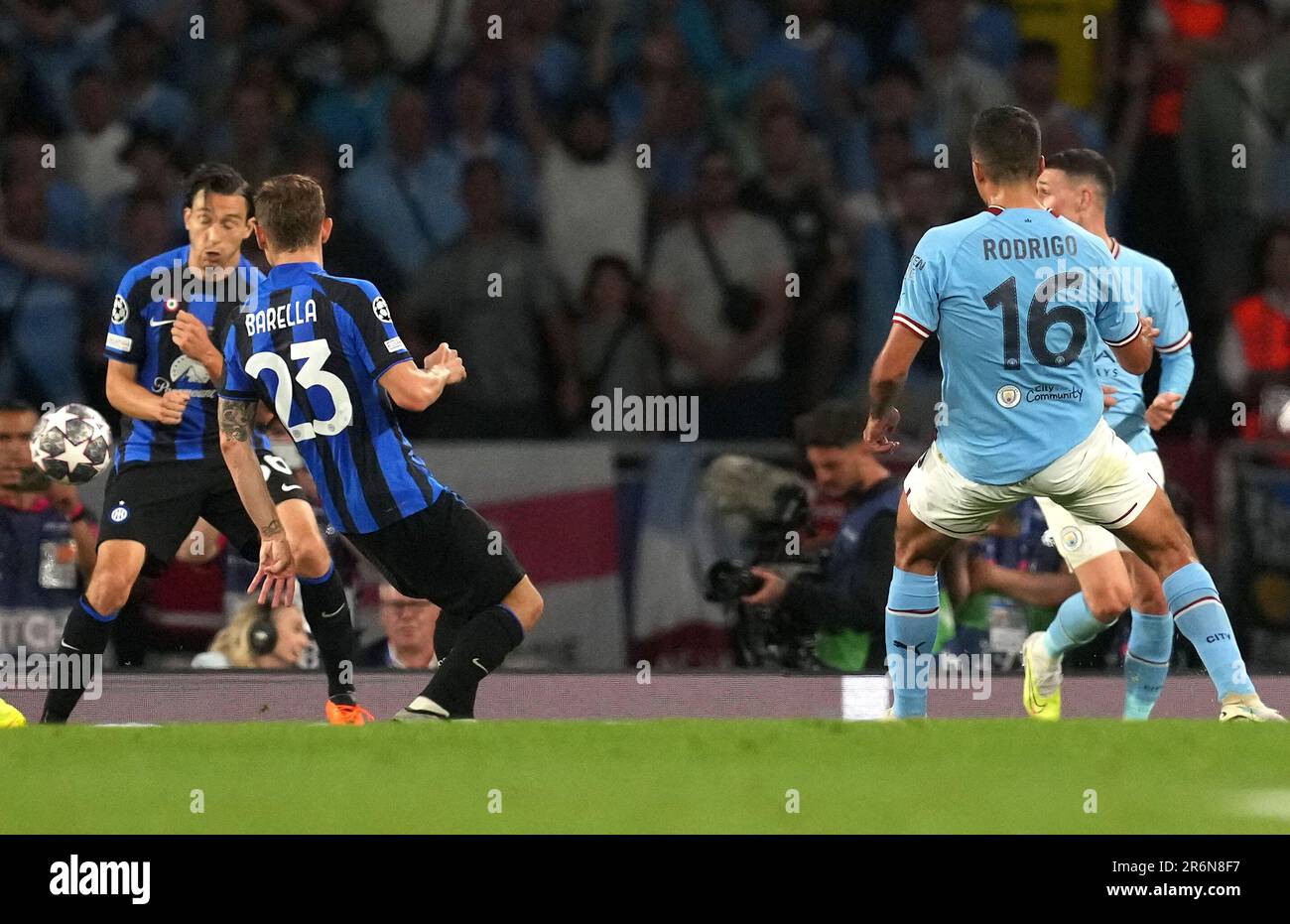 Manchester City's Rodri (right) scores their side's first goal of the ...