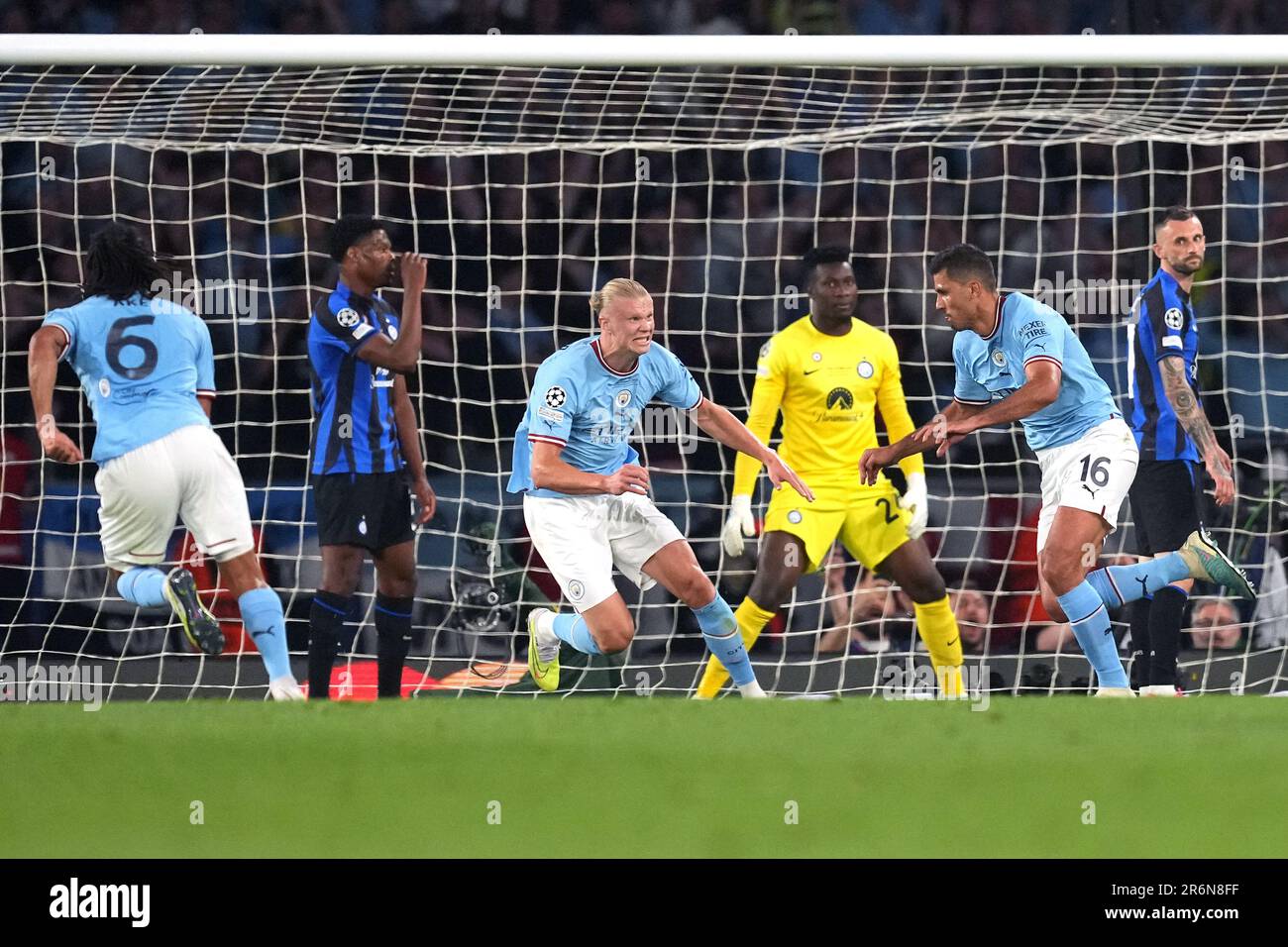 Manchester City's Rodri (second right) celebrates scoring their side's ...