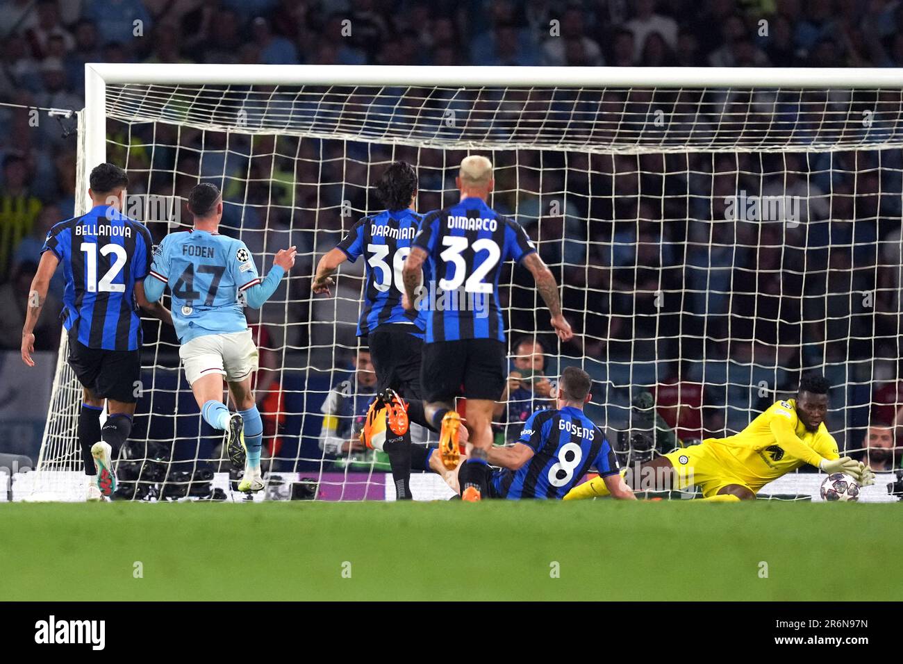 Manchester City's Phil Foden (second left) sees his shot on goal saved ...