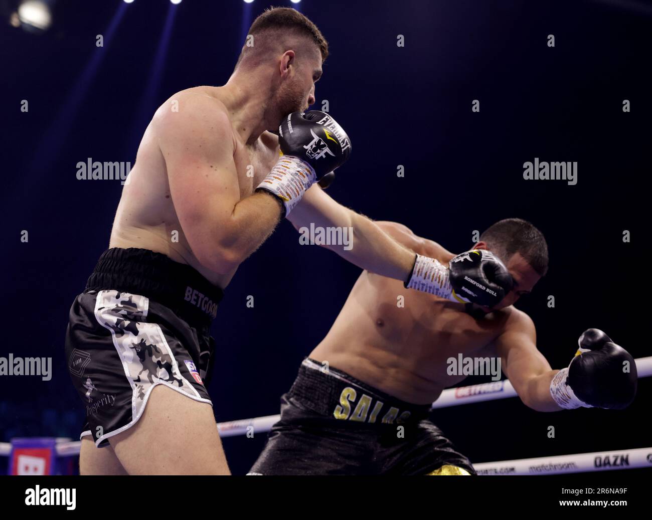 Johnny Fisher (left) hits out at Emilio Salas during the International ...