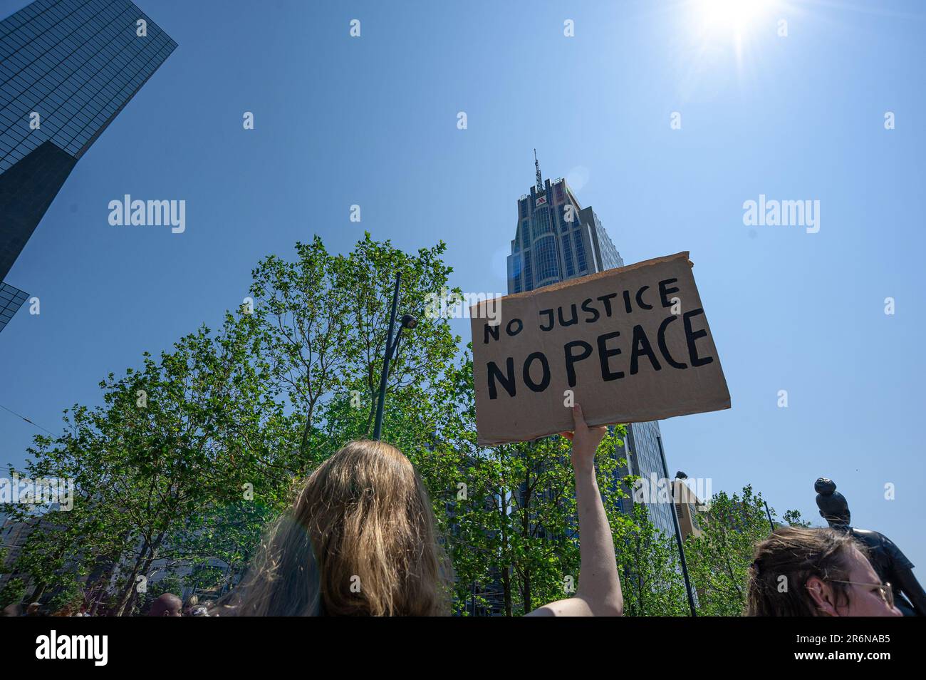 A protester holds a placard expressing her opinion during the Black ...