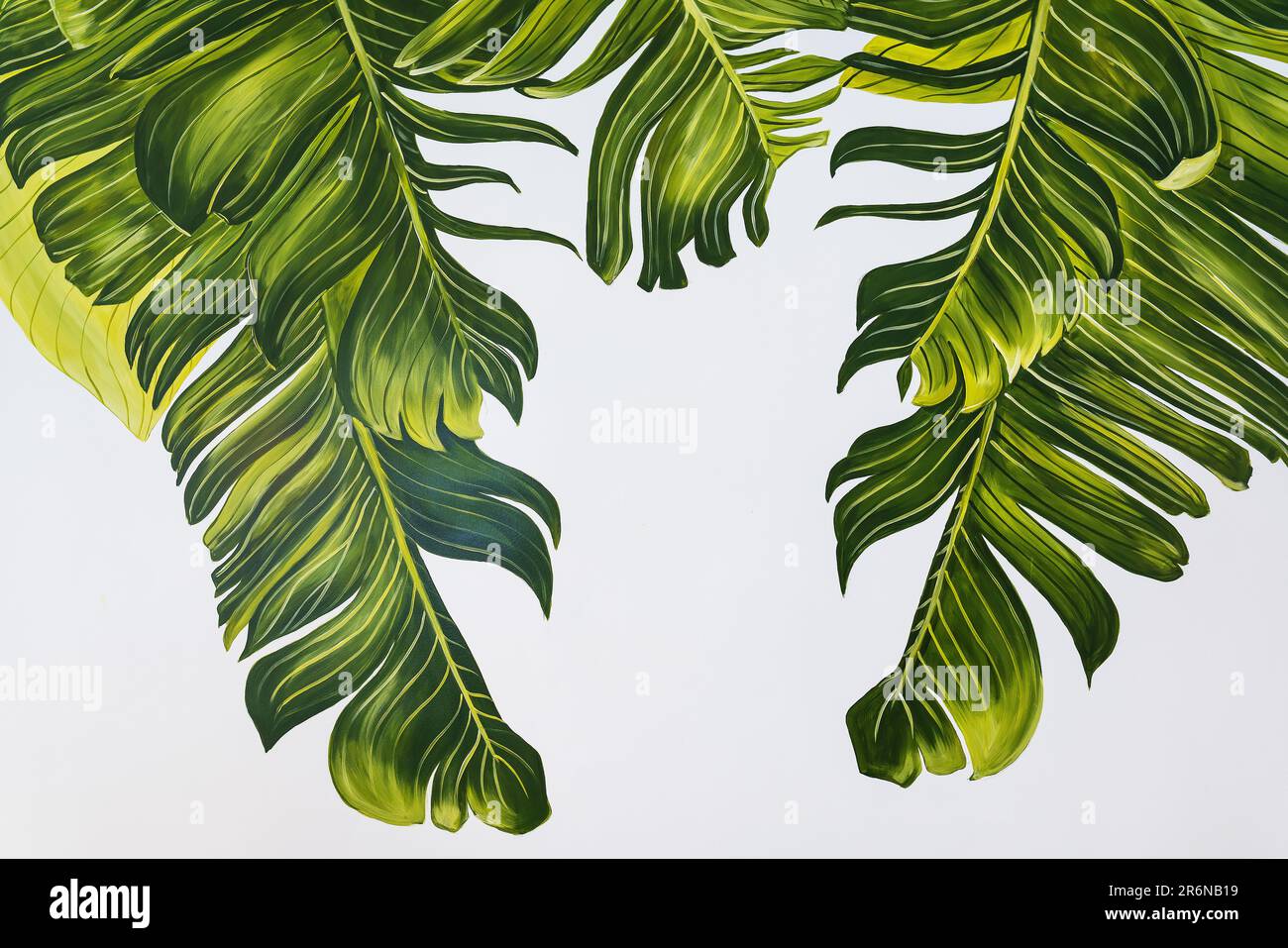 Tropical palm leaves are beautifully painted with acrylic paint in ...
