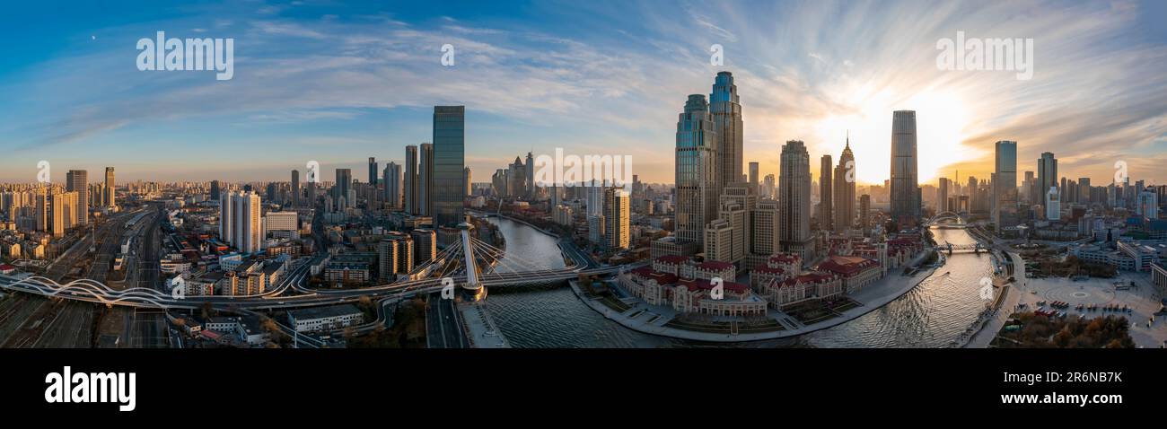 An aerial view of a bustling city skyline featuring numerous multi-level buildings adjacent to ...