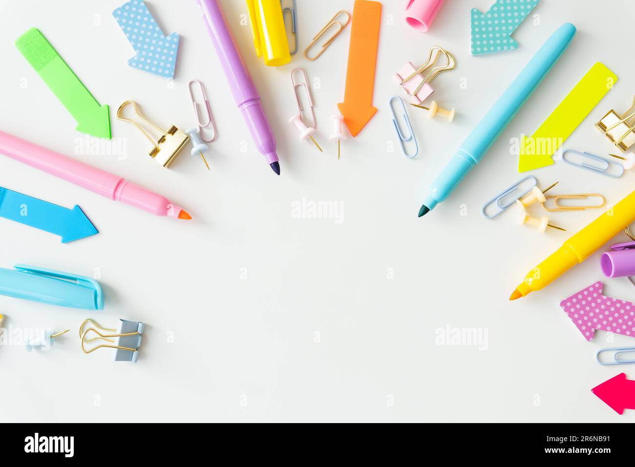 Stationery, school supplies on a white table in bright pastel colors ...