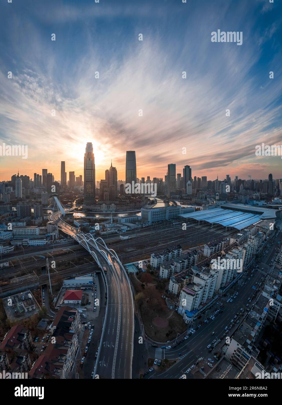 This image captures a stunning sunset in a bustling cityscape Stock ...
