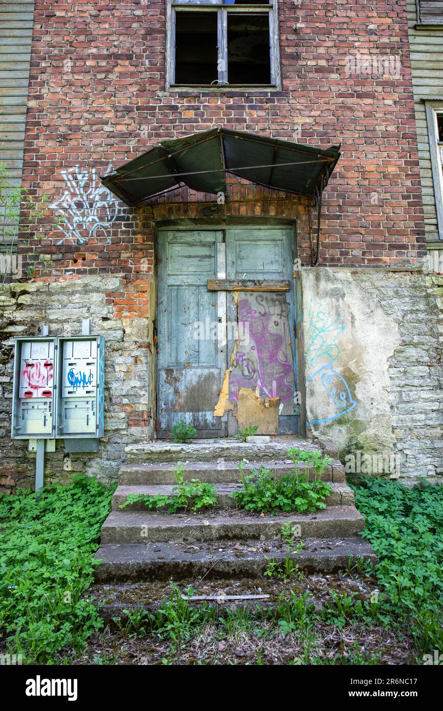 Entrance to abandoned and derelict residential building at Kopli Lines ...