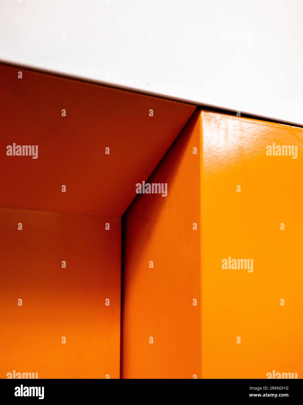 A minimalist interior design featuring an angled corner between two ...