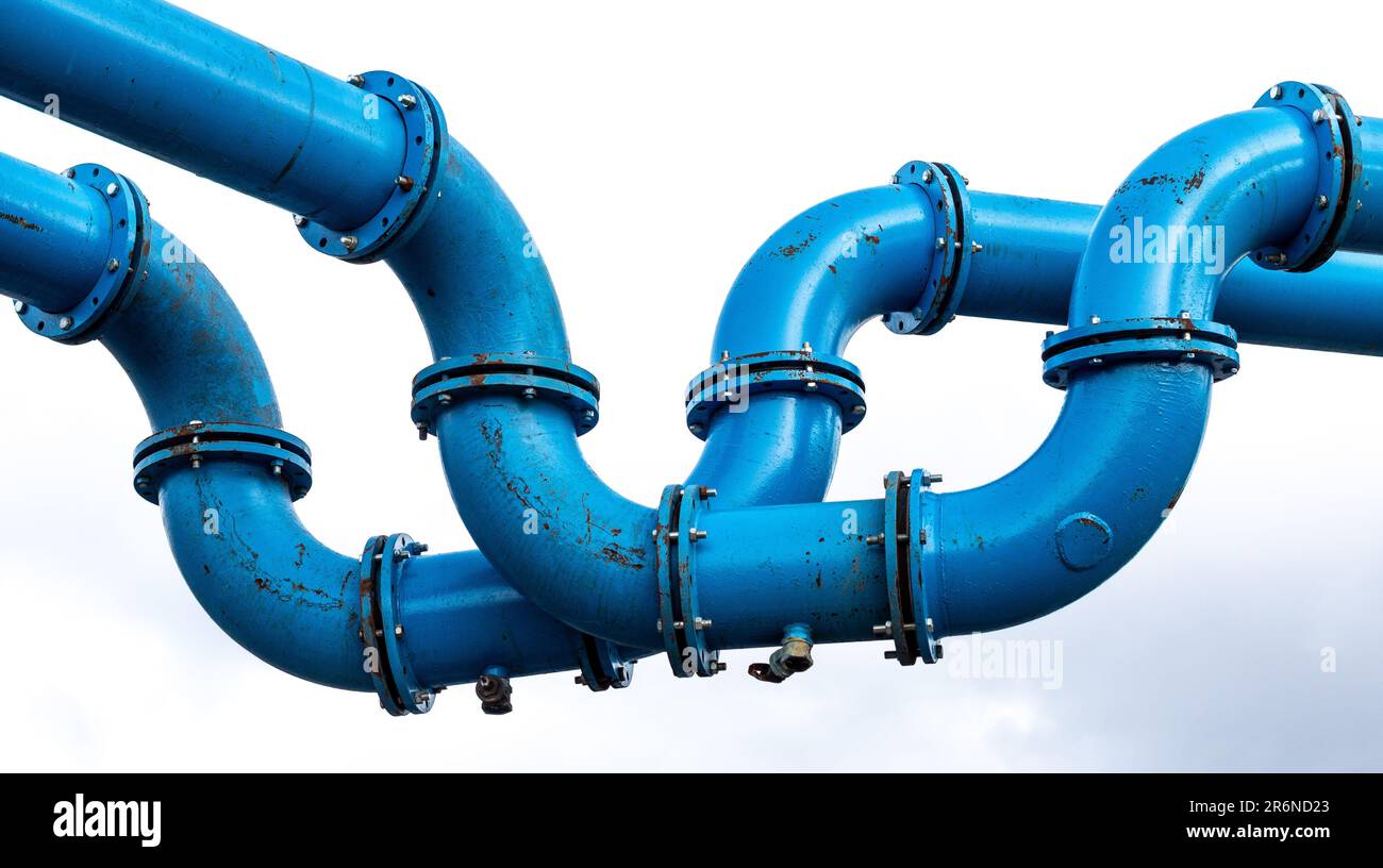 A close-up shot of multiple blue pipes connected to a series of ...