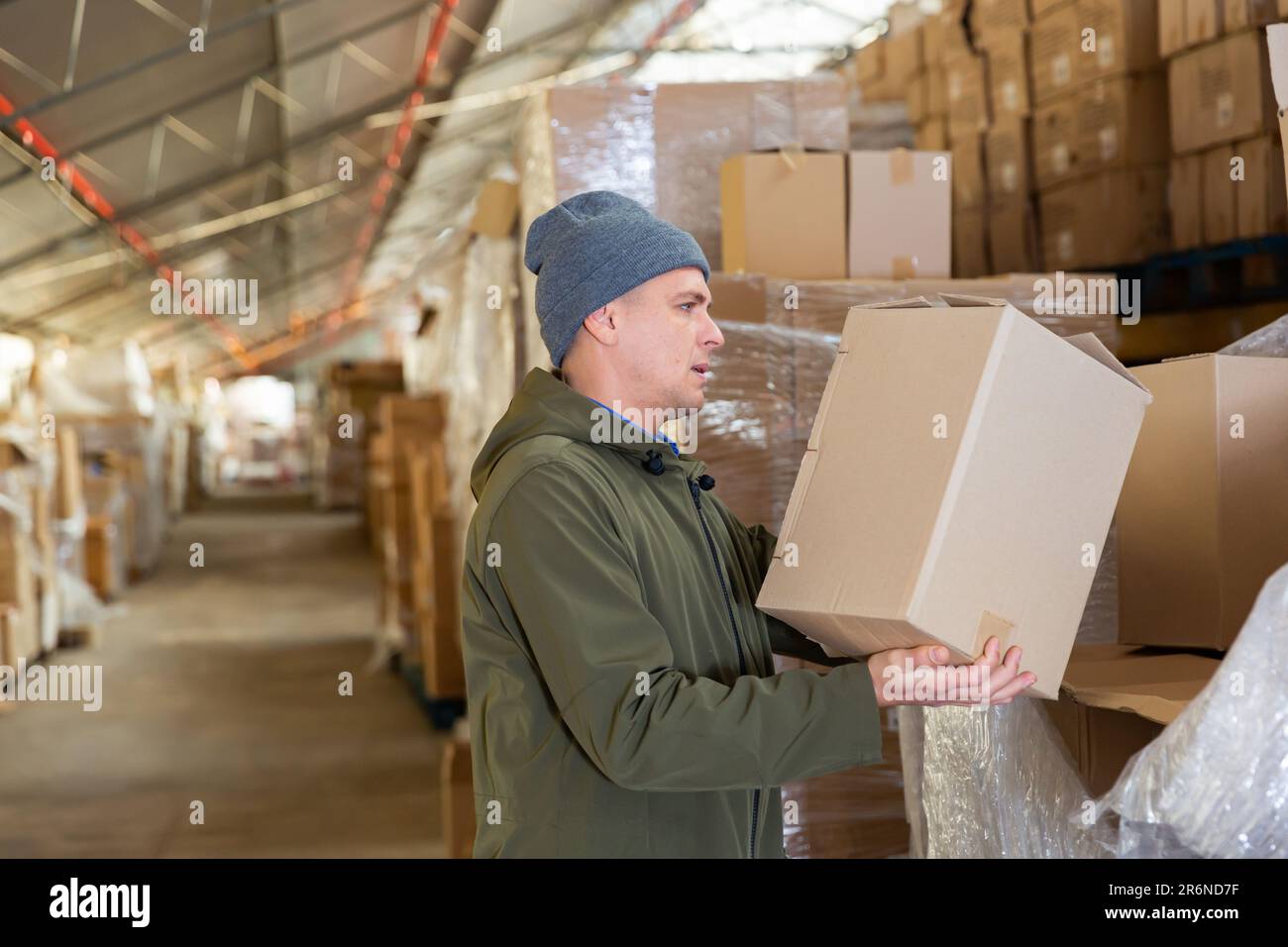 Manual worker box unloading transportation hi-res stock photography and ...