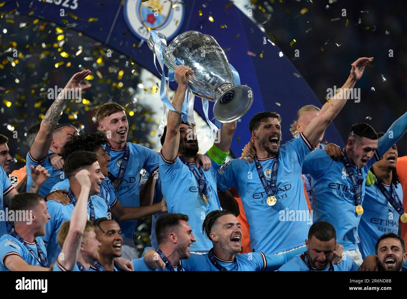 Manchester City's Ilkay Gundogan holds up the trophy after winning the ...
