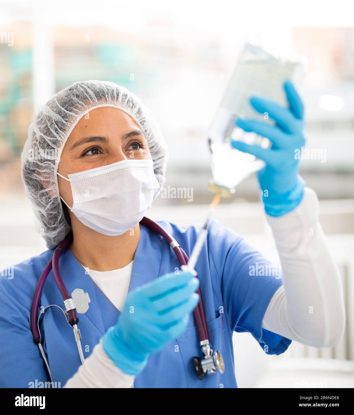 Professional nurse woman making injection in hospital Stock Photo - Alamy