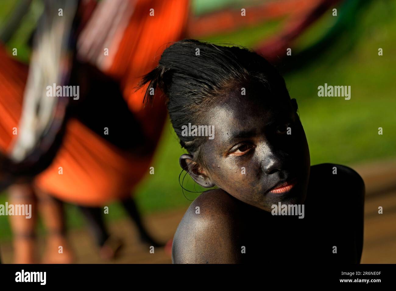 A girl rests after taking part in the afternoon rituals of the second ...