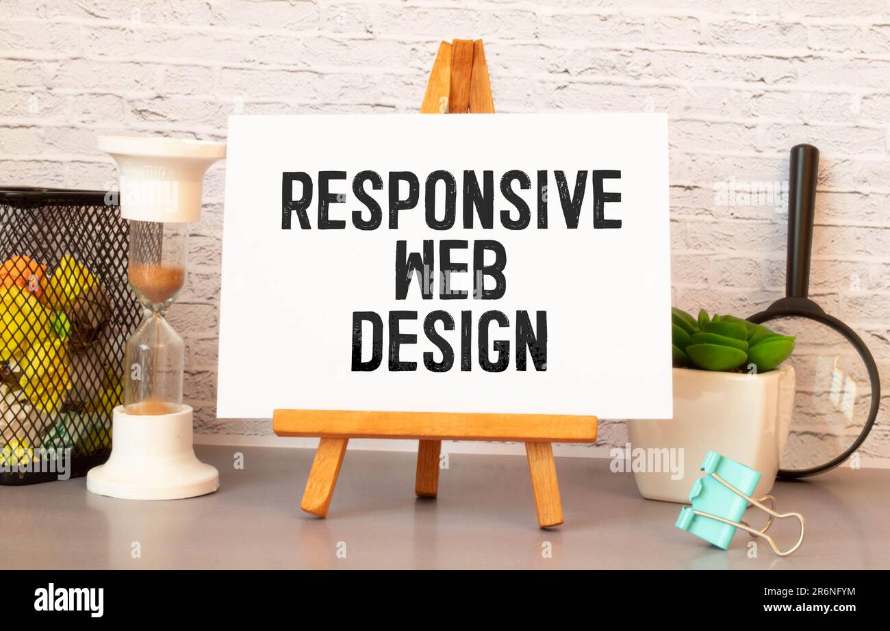 Web design text on work desk surrounded with web development team ...