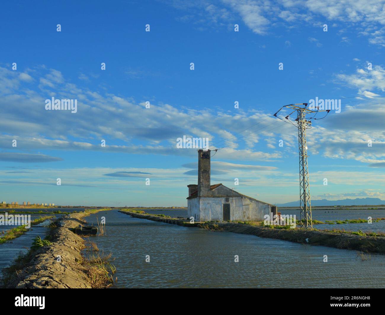 An industrial complex located on the edge of a river, with electrical ...