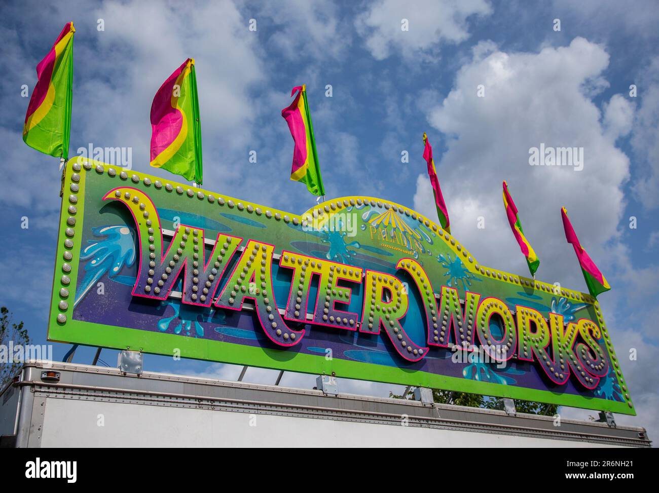 Sign over an amusement park ride at a carnival Stock Photo - Alamy