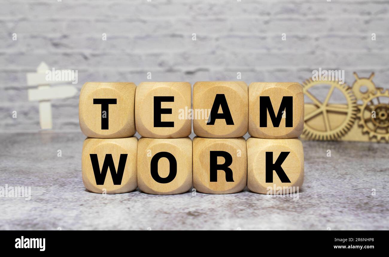 TEAMWORK word written on wood block Stock Photo - Alamy