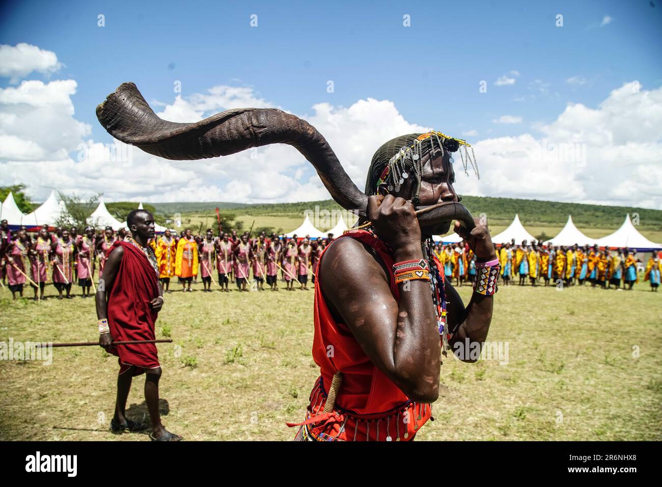 Narok, Kenya. 10th June, 2023. A Maasai man wearing their traditional attires blows a horn ...