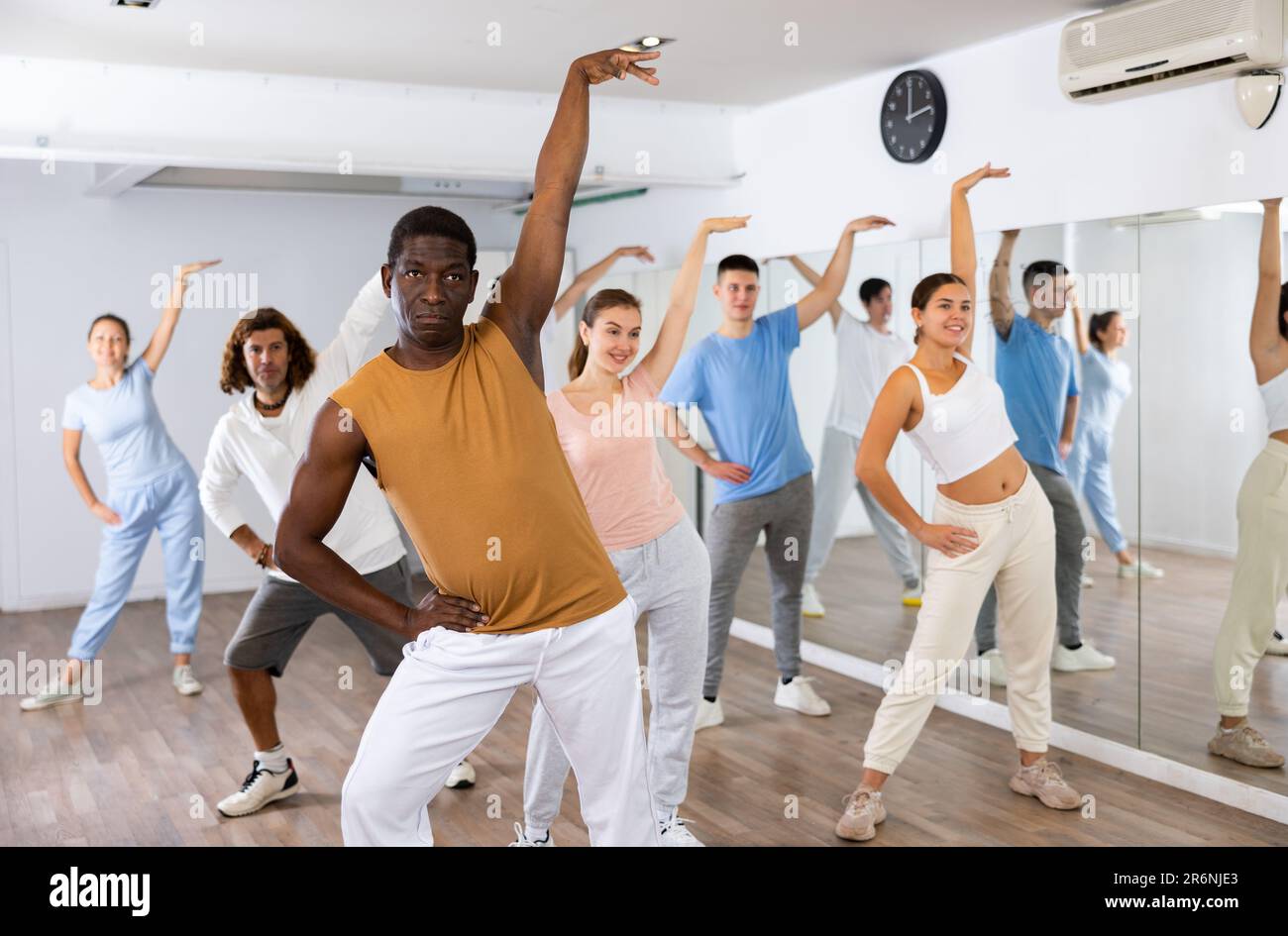 African american man practicing active dance moves during rehearsal ...