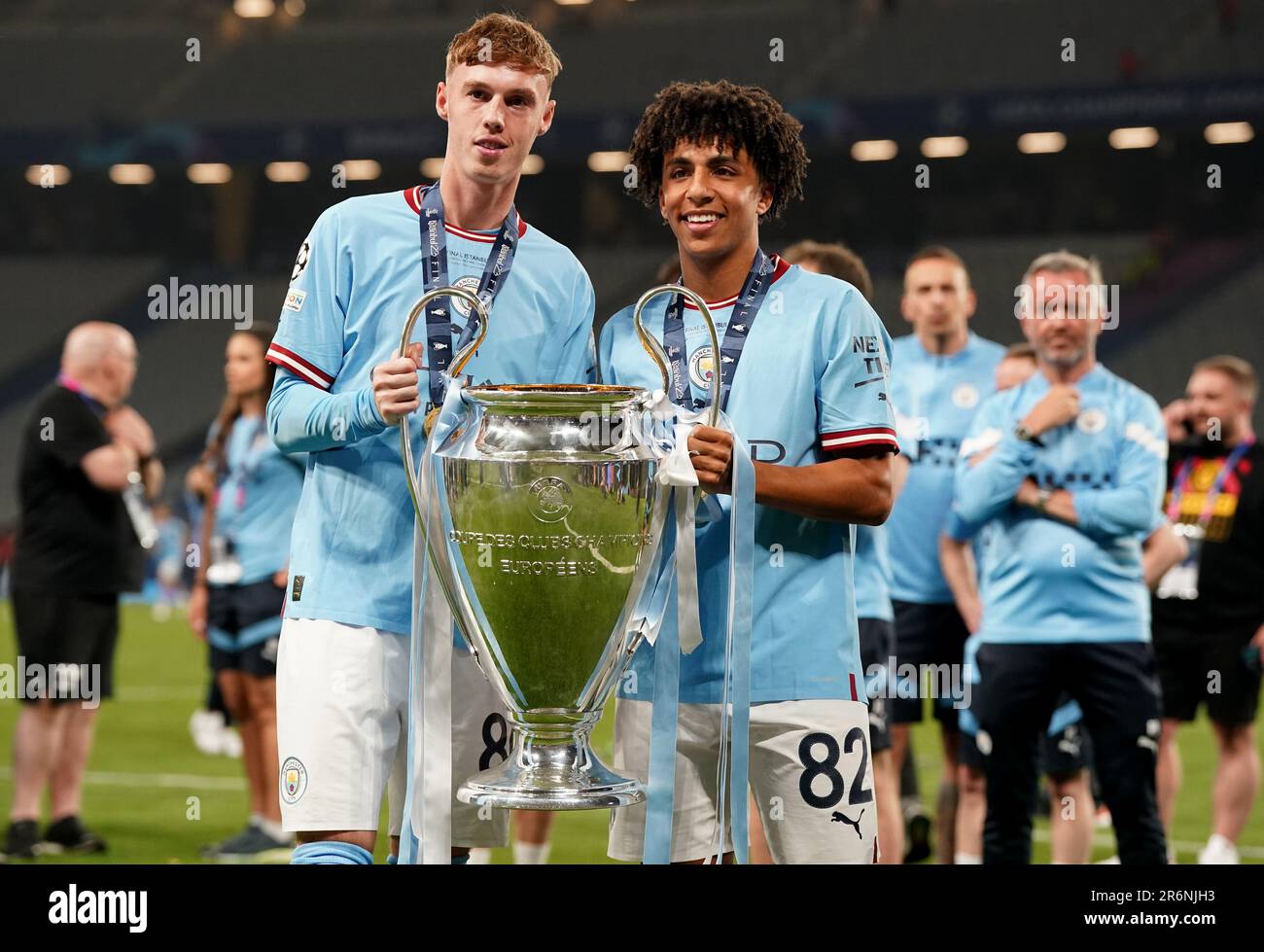 Manchester City's Rico Lewis and Cole Palmer (left) with the UEFA ...