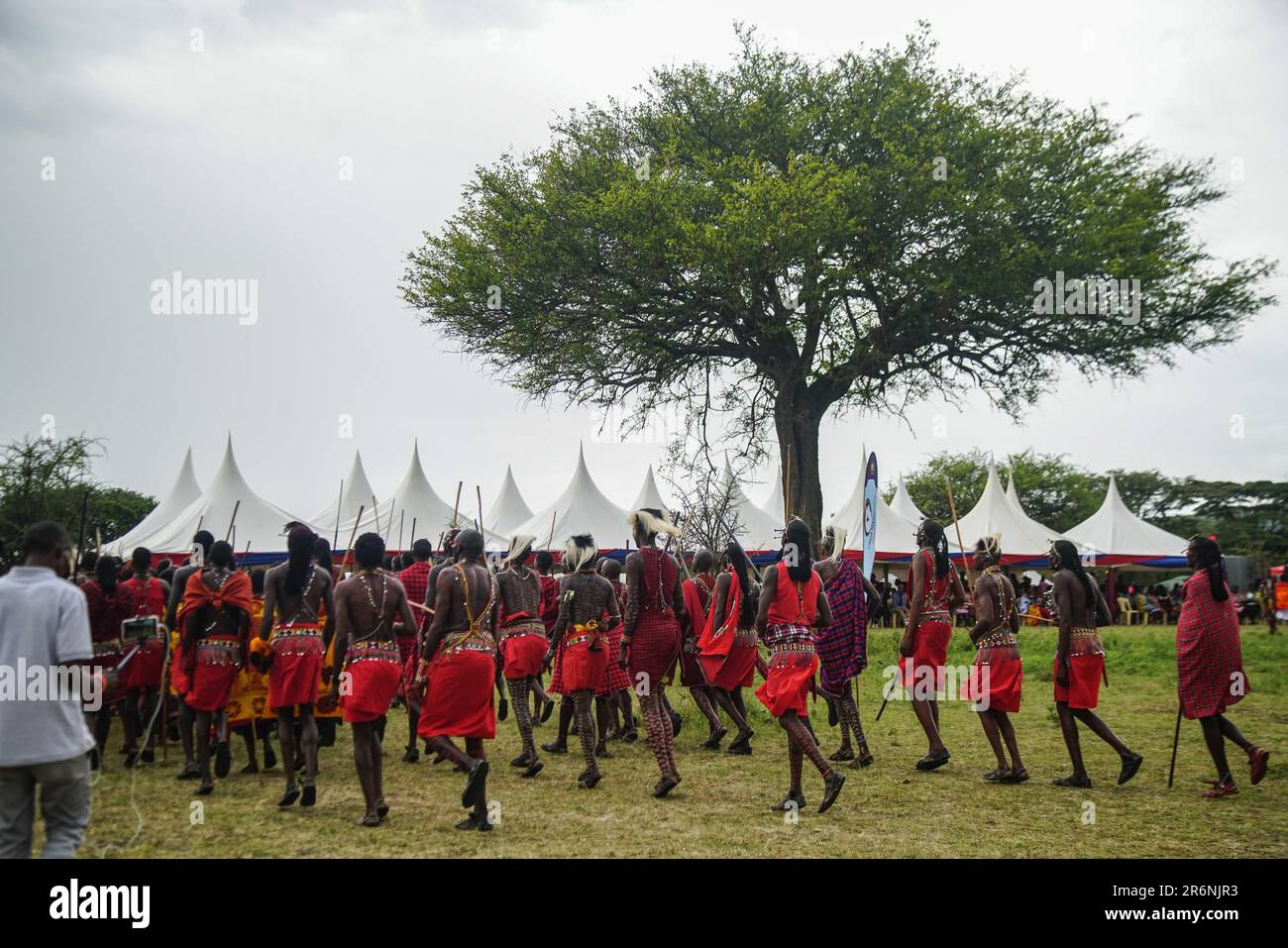 Narok, Kenya. 10th June, 2023. Maasai men wearing their traditional attires dance and sing ...