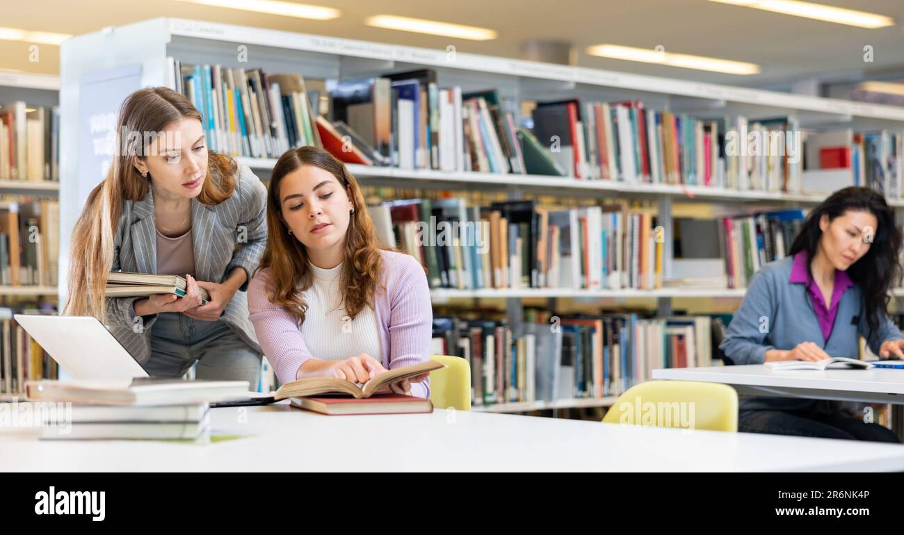 Two colleagues studying digital hi-res stock photography and images - Alamy