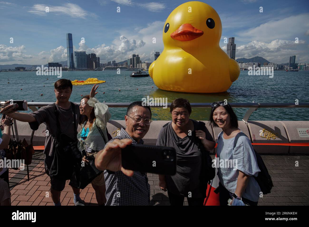 People take selfies in front of an enormous inflatable duck which ...