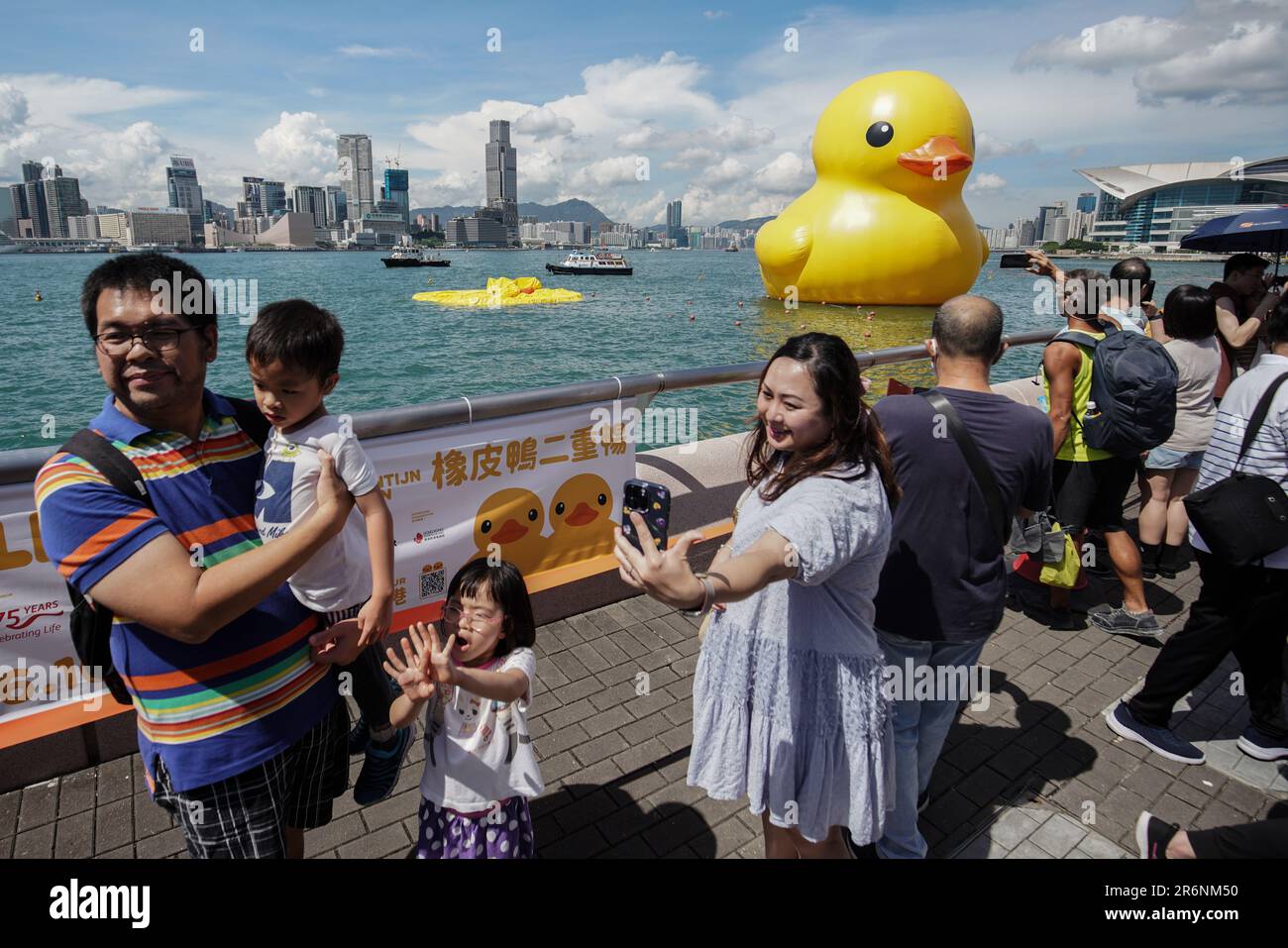 People visit and take photos in front of an enormous inflatable duck ...