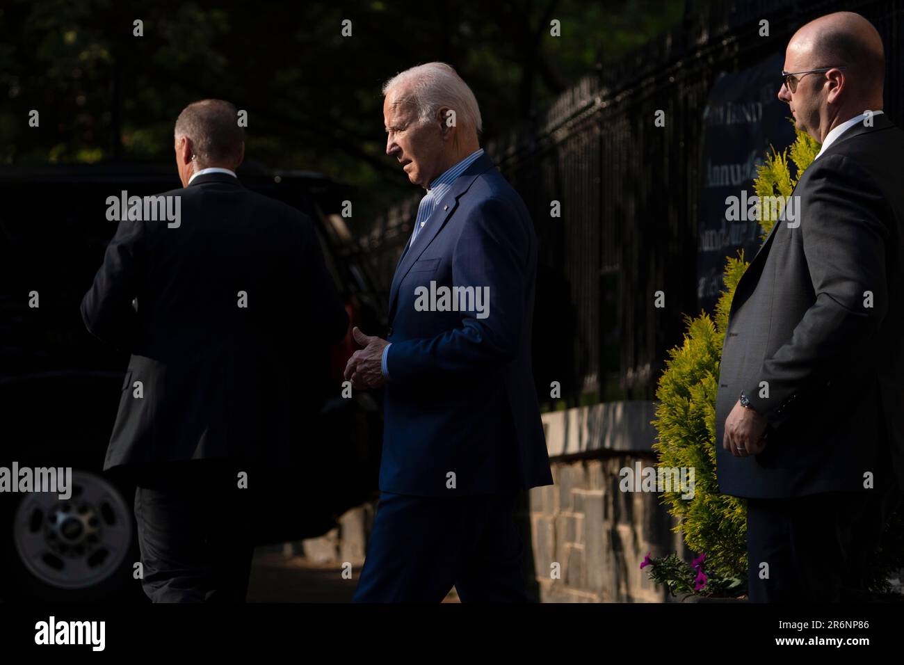 President Joe Biden is guarded by Secret Service agents as he leaves ...