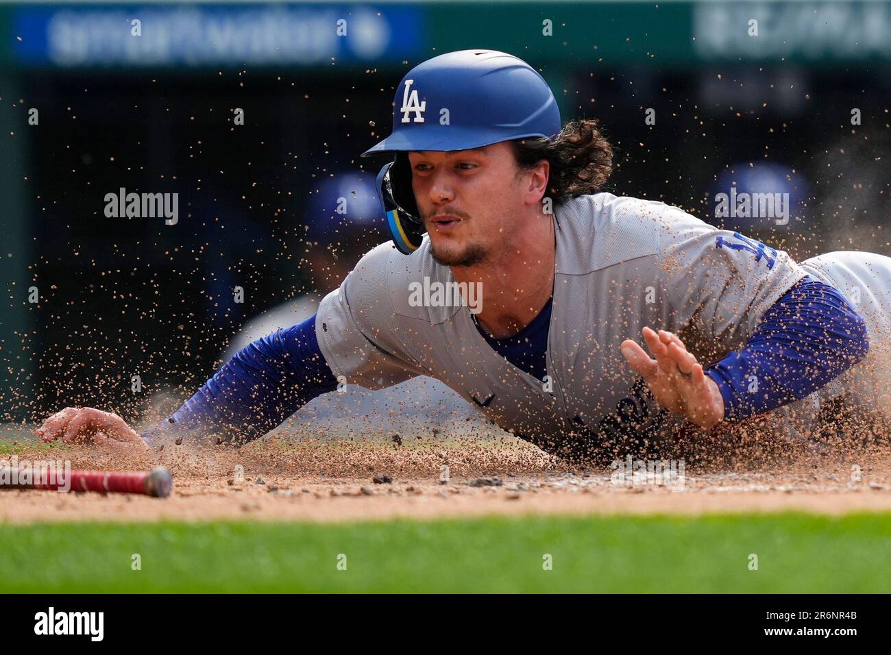 Los Angeles Dodgers' James Outman scores off a hit by Mookie Betts ...