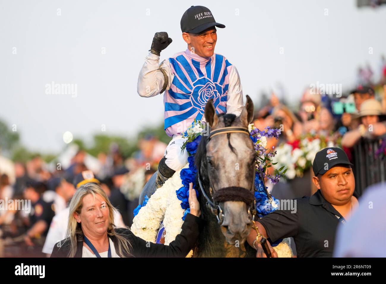 Jockey Javier Castellano, aboard Arcangelo, is led to the winner's ...