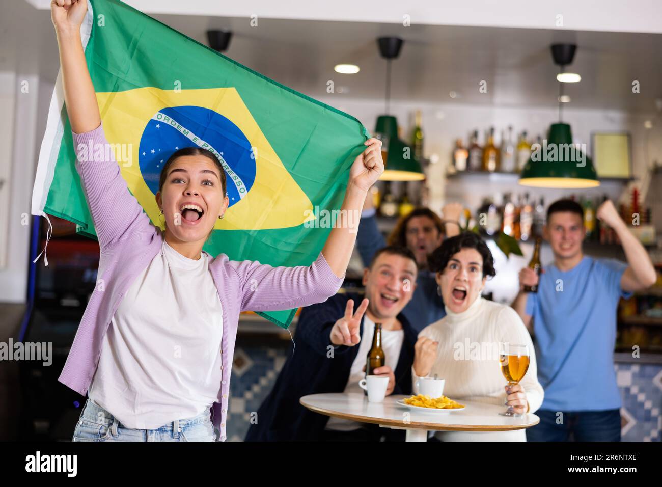 Group of friends, sports supporters cheering for favorite team with ...