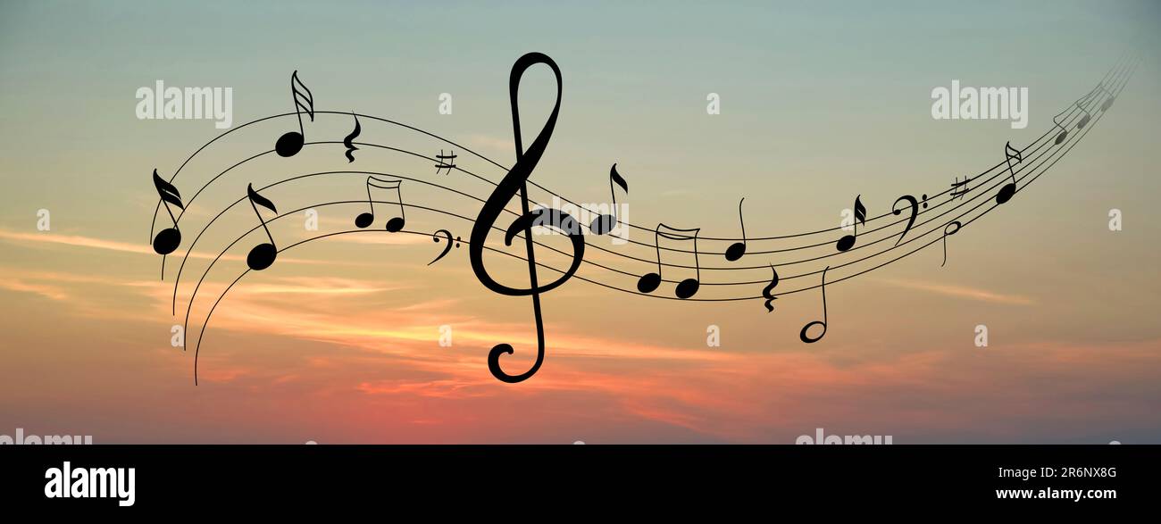 Staff with treble clef and musical notes against sunset sky, banner ...