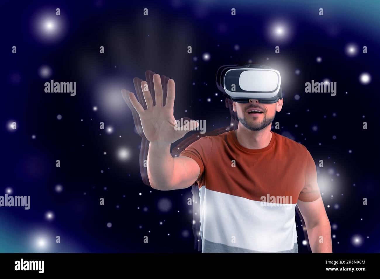 Innovation idea. Man exploring space using VR headset. Lights and blue ...