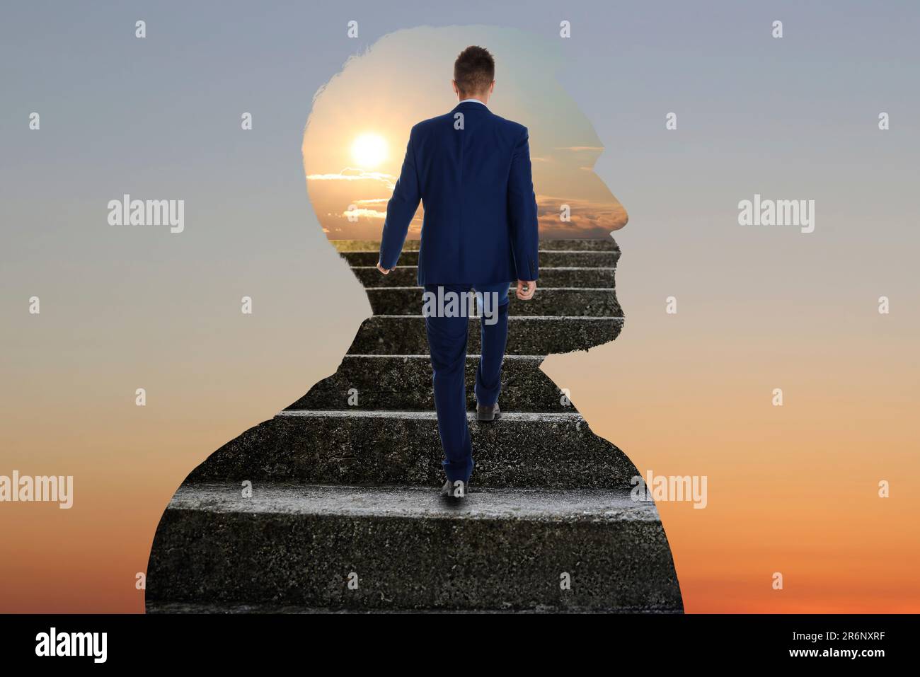 Thinking about steps to success. Businessman climbing up stairs inside ...