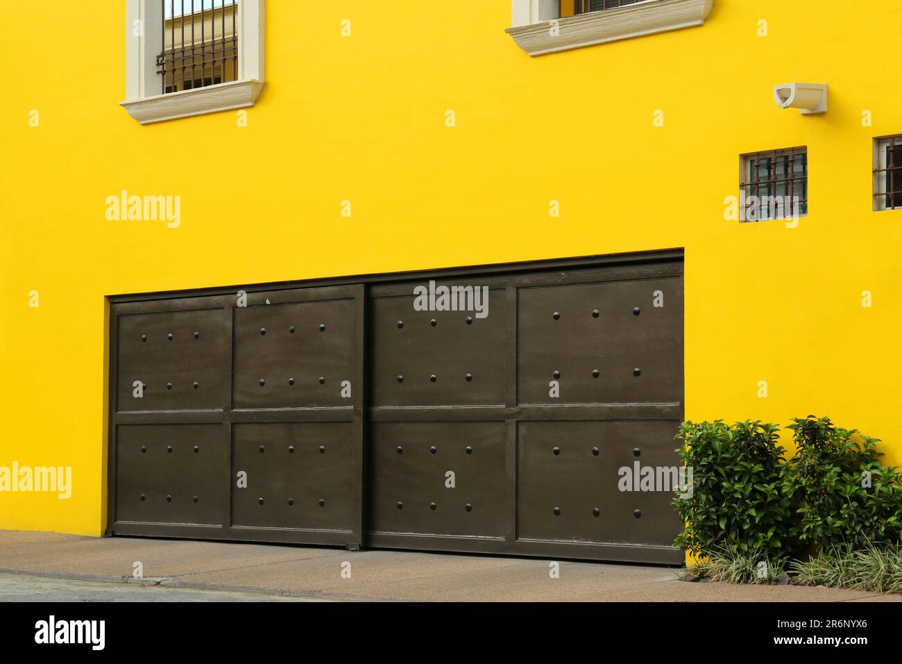 Closed metal gates of modern garage. Exterior design Stock Photo - Alamy