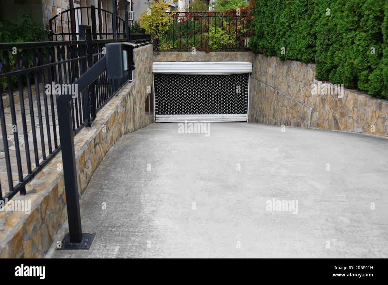 Closed underground parking with modern intercom system Stock Photo - Alamy